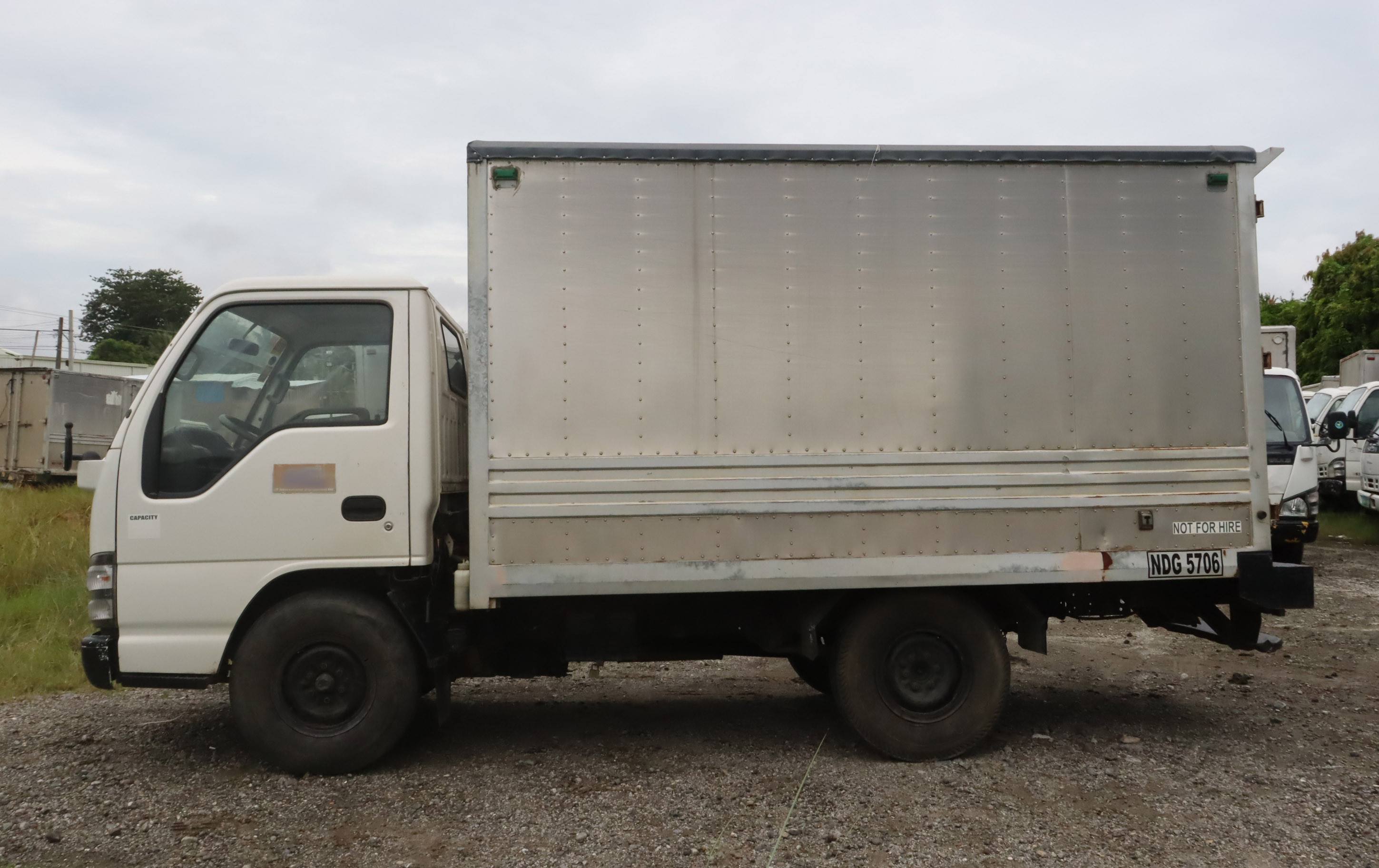 2017 Isuzu NHR 4X2 4W Aluminum Van | 1 Unit — Lot 12 | HMR Shop N' Bid